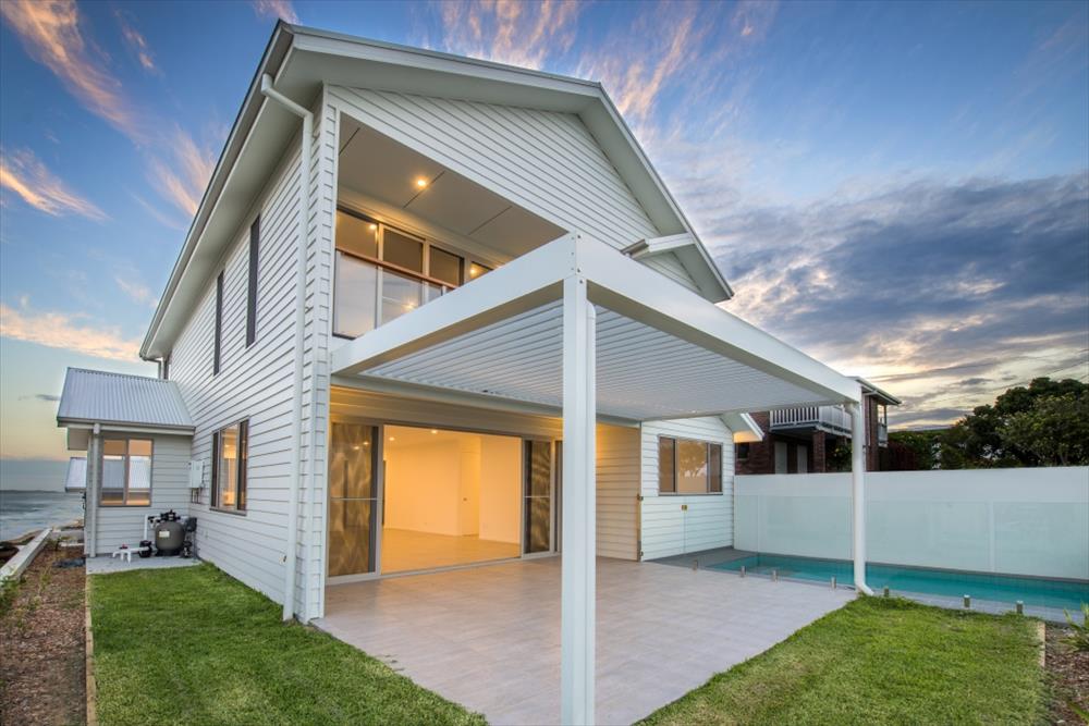Custom designed triplex (two attached and one detached) on a steep site ...